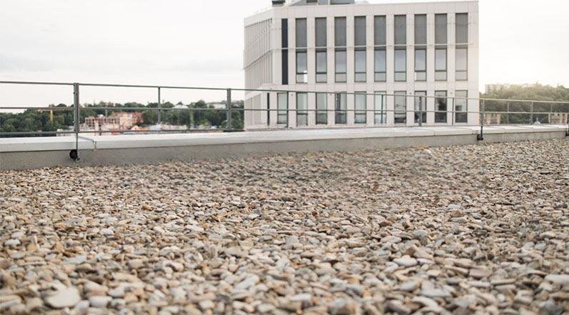 What Are Gravel and Stone Ballasts For on Commercial Roofs?